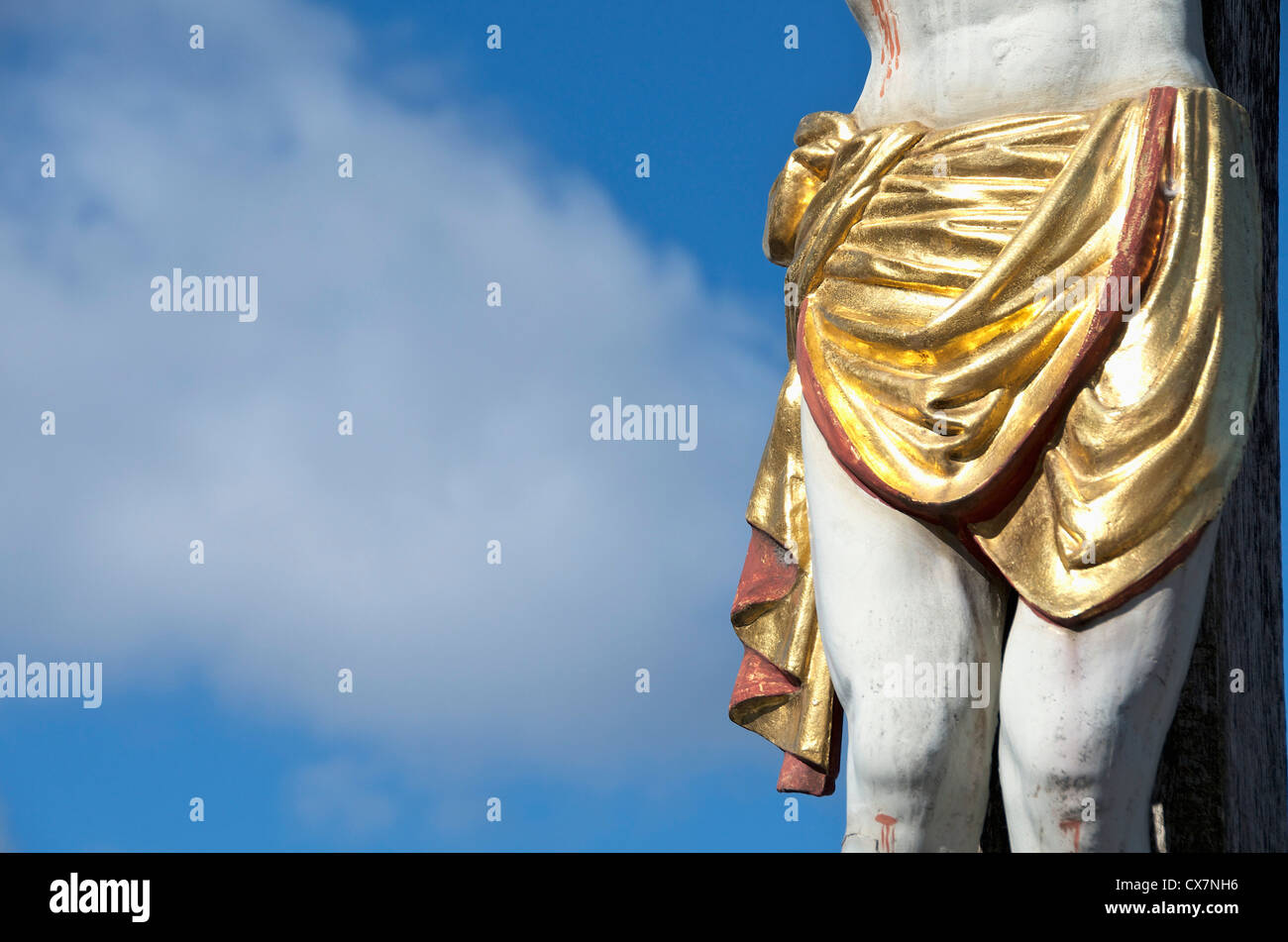 Gold loin cloth of Jesus statue Stock Photo - Alamy