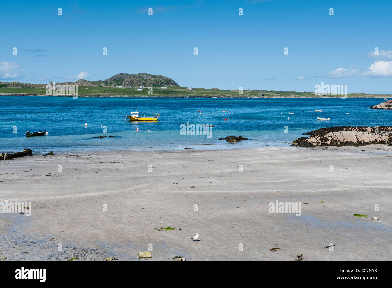 Fionnphort harbour with fishing boats, crab pots and the ferry to Iona ...