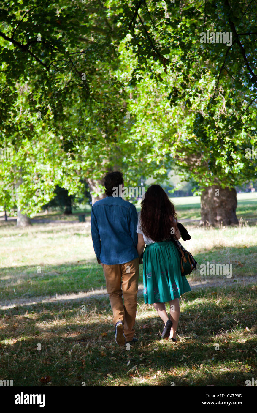 Couple strolling in Park Stock Photo - Alamy
