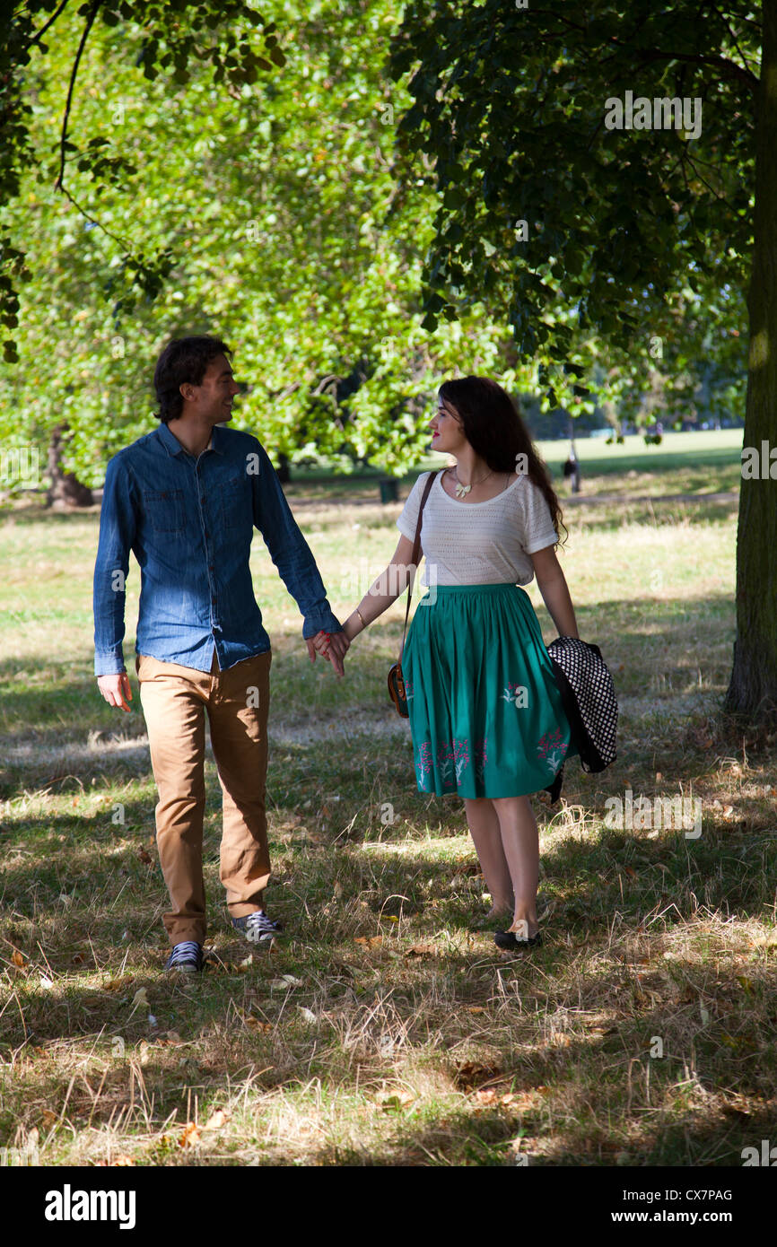 Couple strolling in Park Stock Photo - Alamy