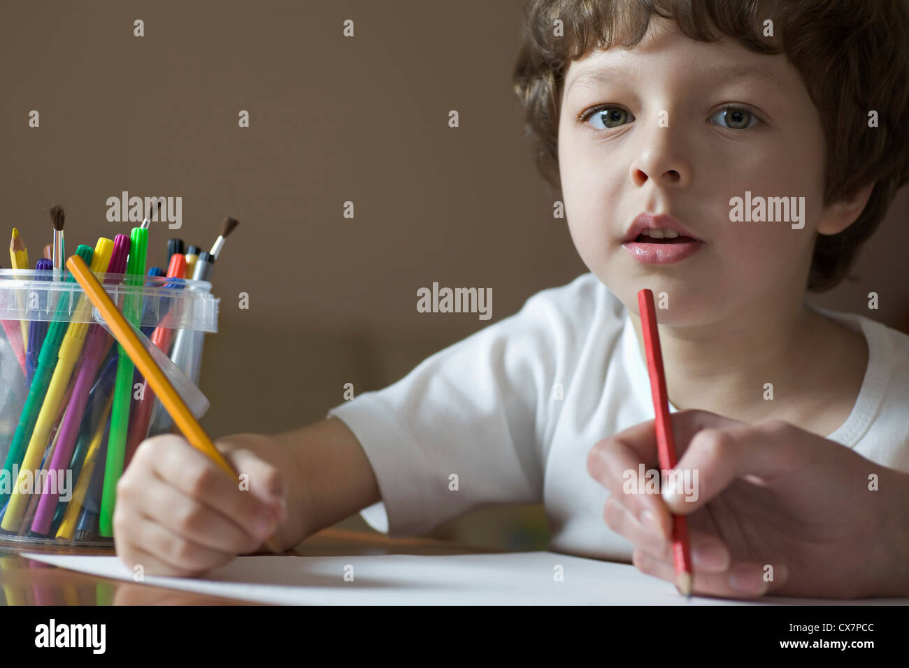 Boy holding a drawing hi-res stock photography and images - Alamy