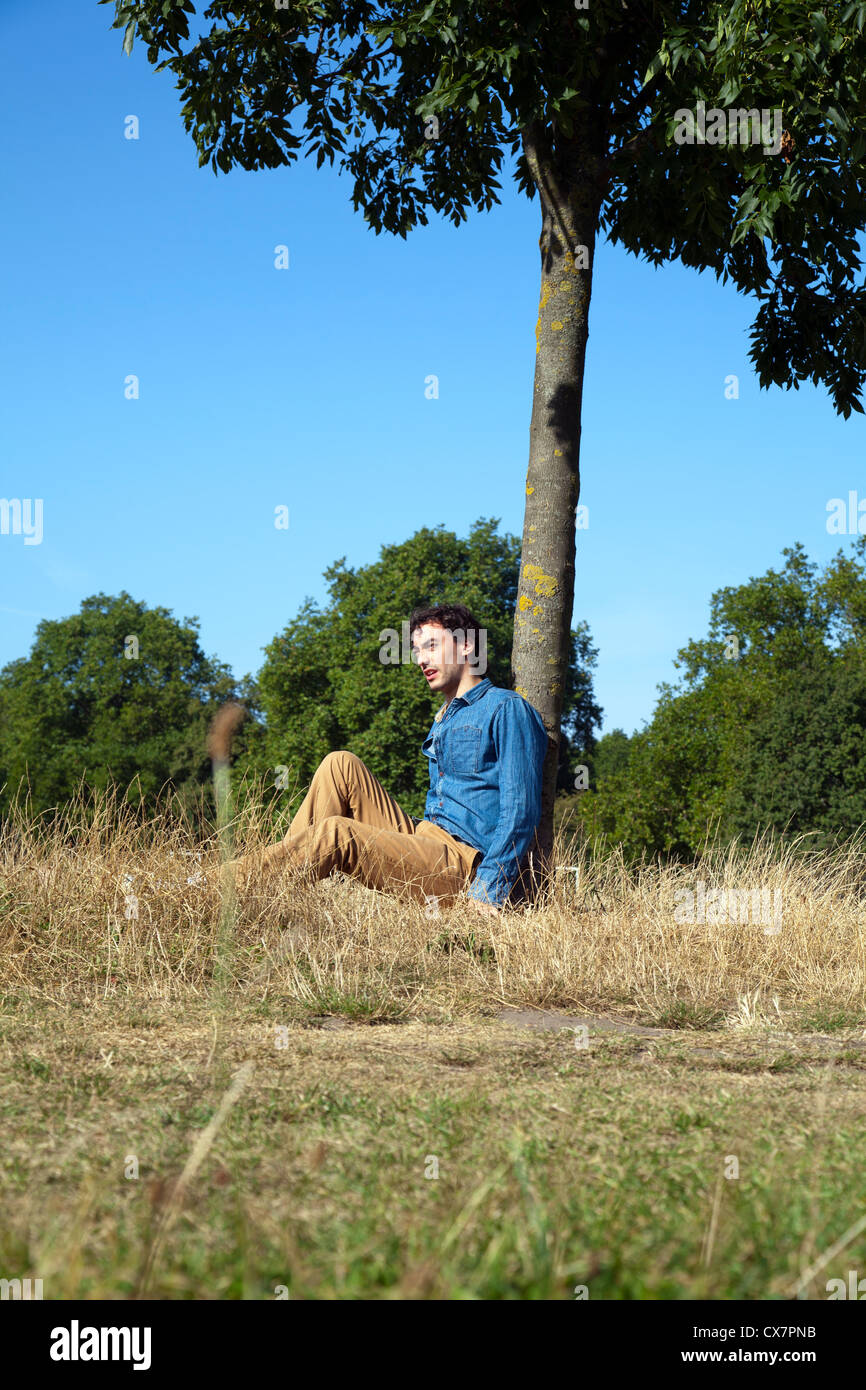 Lean against tree hi-res stock photography and images - Alamy