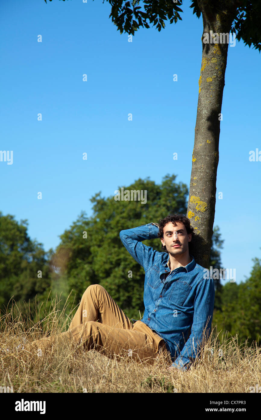 Lean against tree hi-res stock photography and images - Alamy