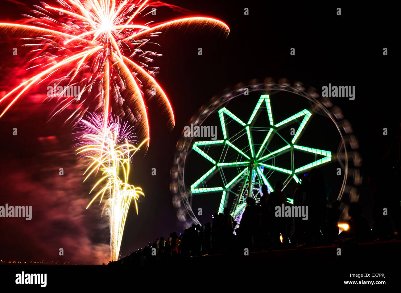 New Year's revelers watch fireworks display by bay, Philippines Stock ...