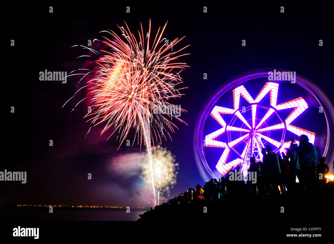 New Year's revelers watch fireworks display by bay, Philippines Stock ...