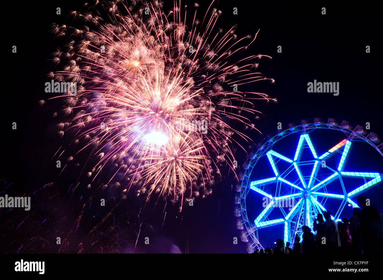 New Year's revelers watch fireworks display by bay, Philippines Stock ...