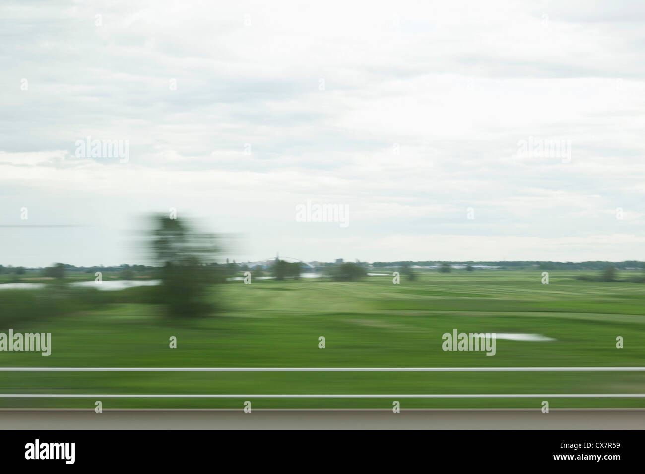 A rural landscape in blurred motion viewed from a moving train Stock ...