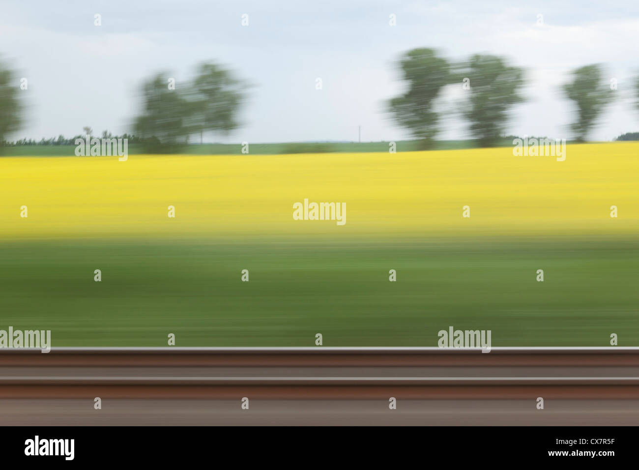 A rural landscape in blurred motion viewed from a moving train Stock ...