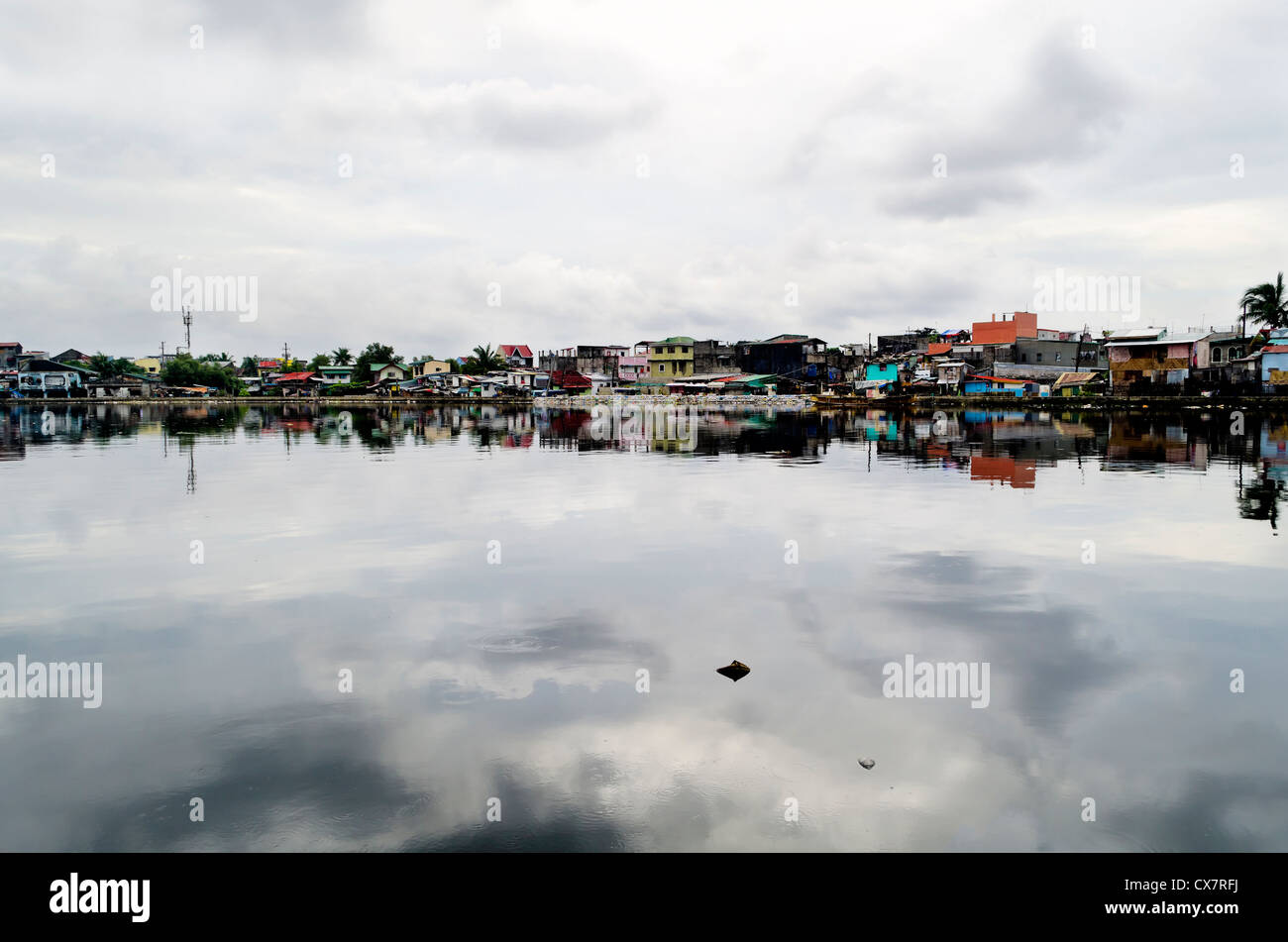 Rows of houses along the Malabon River in Metro Manila, Philippines ...