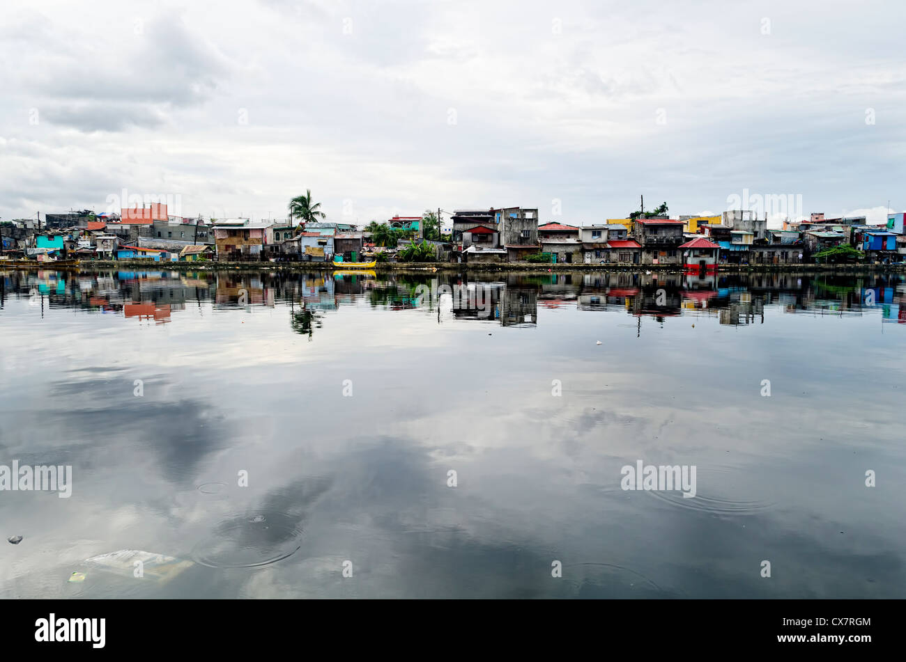 Rows of houses along the Malabon River in Metro Manila, Philippines ...