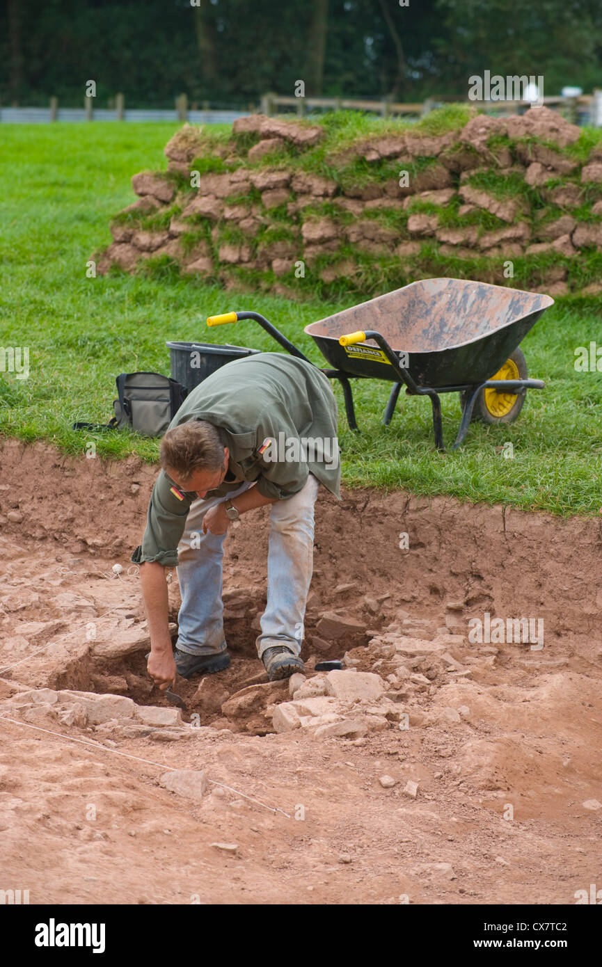 Archaeologist digging a prehistoric neolithic site on Dorstone Hill ...