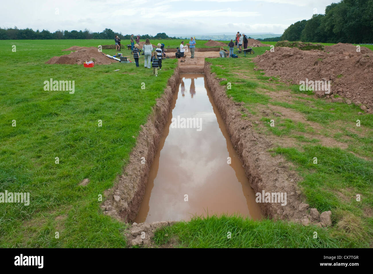 Flooded trench on archaeology dig of prehistoric neolithic site on ...