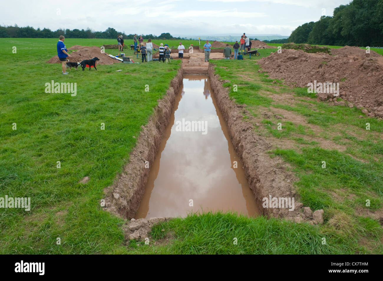 Flooded trench on archaeology dig of prehistoric neolithic site on ...