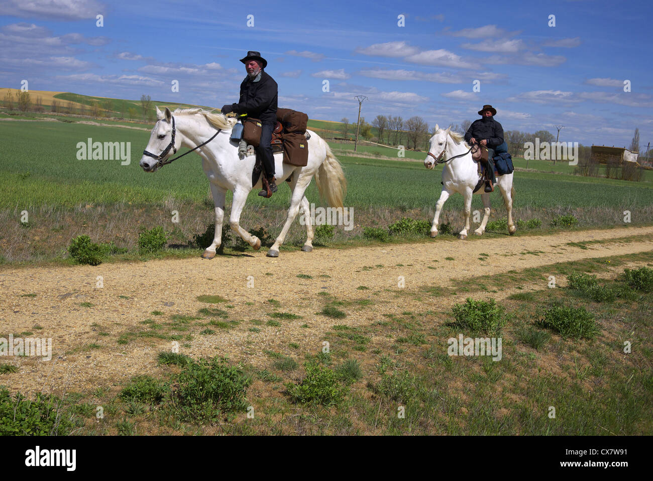 Two pilgrims on horseback en route to Santiago de Compostela, near ...