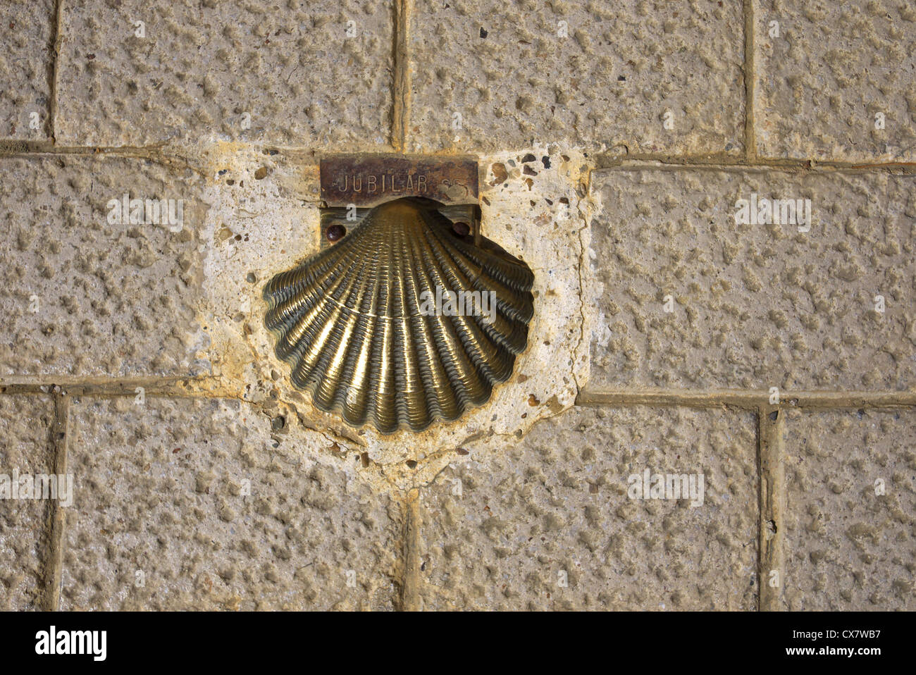A brass scallop shell along the route of the camino to Santiago de ...