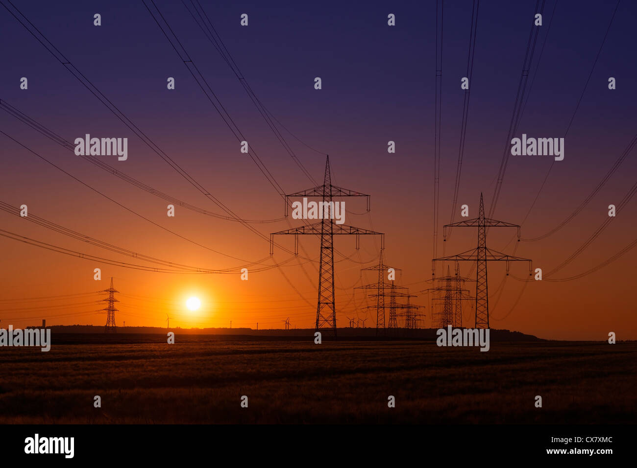 Sunset with Wind Turbines Stock Photo - Alamy