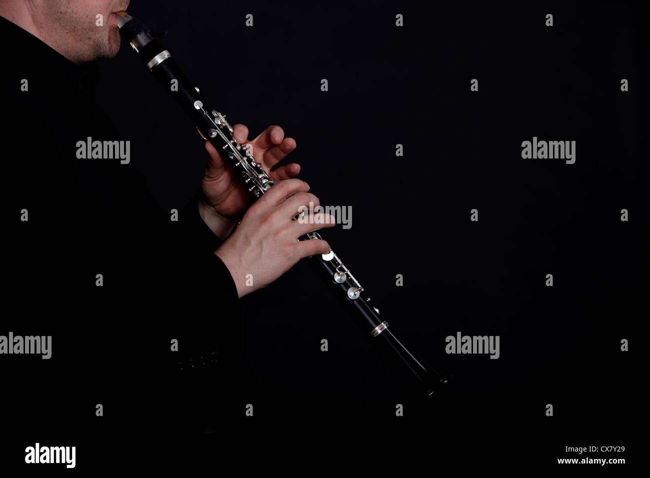 Hands playing clarinet hi-res stock photography and images - Alamy