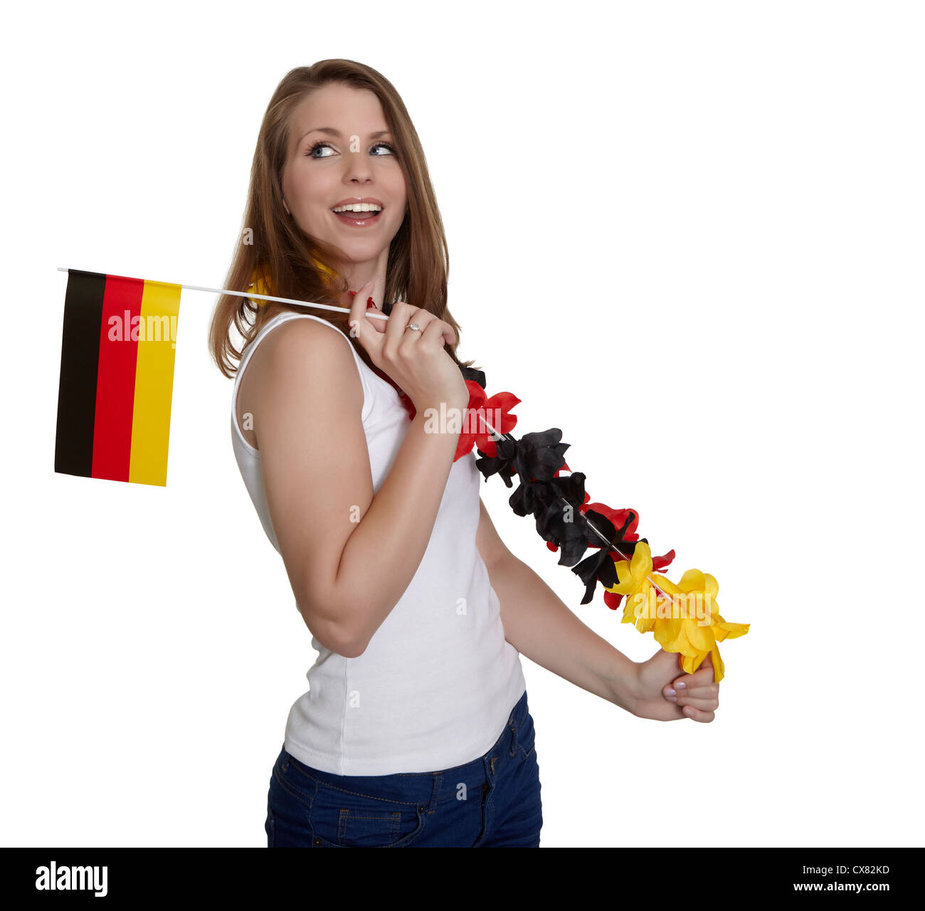 Attractive woman shows german flag and smiles in front of white ...