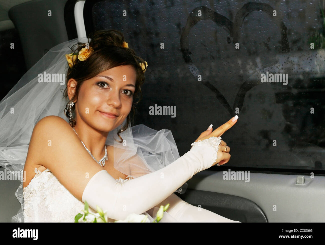 The happy bride in interior of the automobile Stock Photo - Alamy