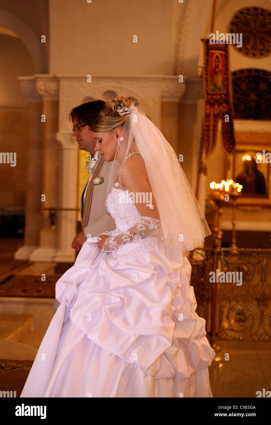 The groom and the bride with candles. Wedding ceremony in church Stock ...