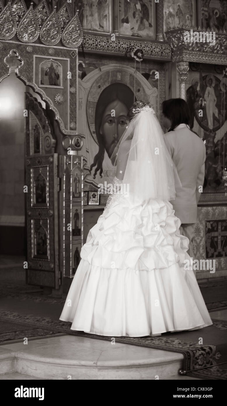The groom and the bride on wedding ceremony in church Stock Photo - Alamy