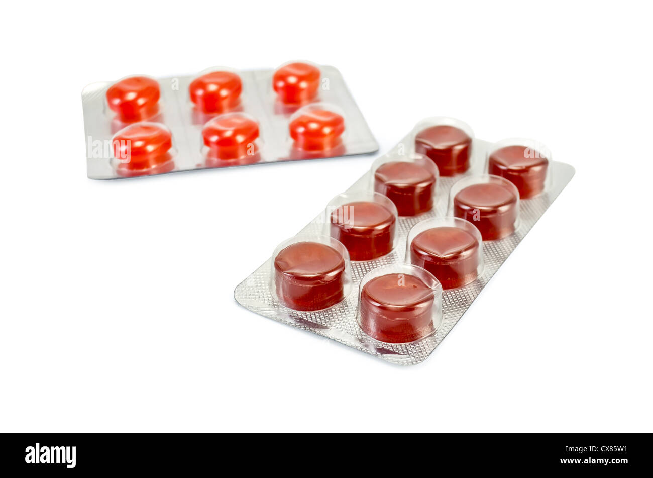 Two different packages of cough pills isolated on white background ...