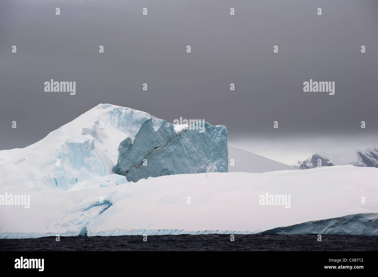 Snow Covered Mountains Along The Coastline; Antarctica Stock Photo - Alamy
