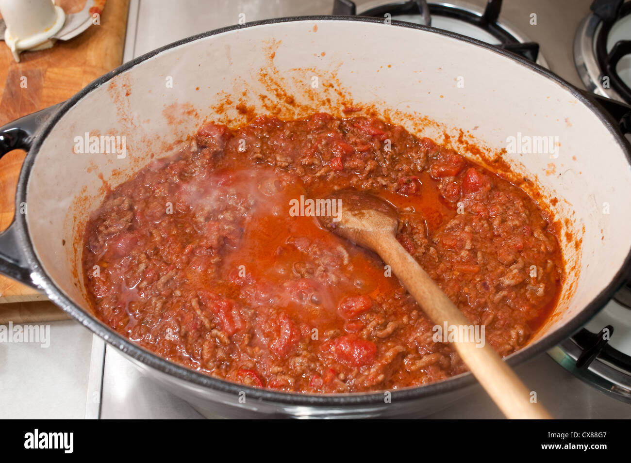 Preparing a chilli con carni meal on gas hob stove cooker 2012 UK Stock ...