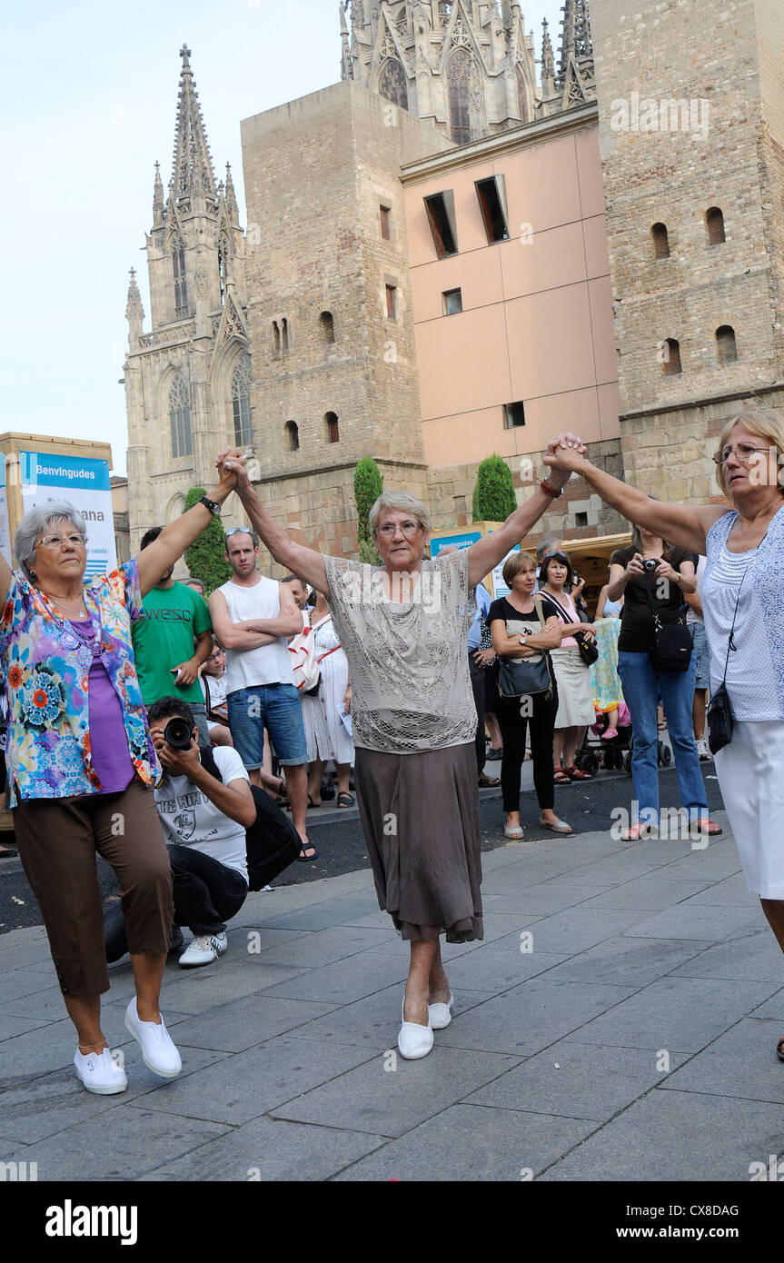 sardanas dancers are dancing to the music of the brass bands of ...
