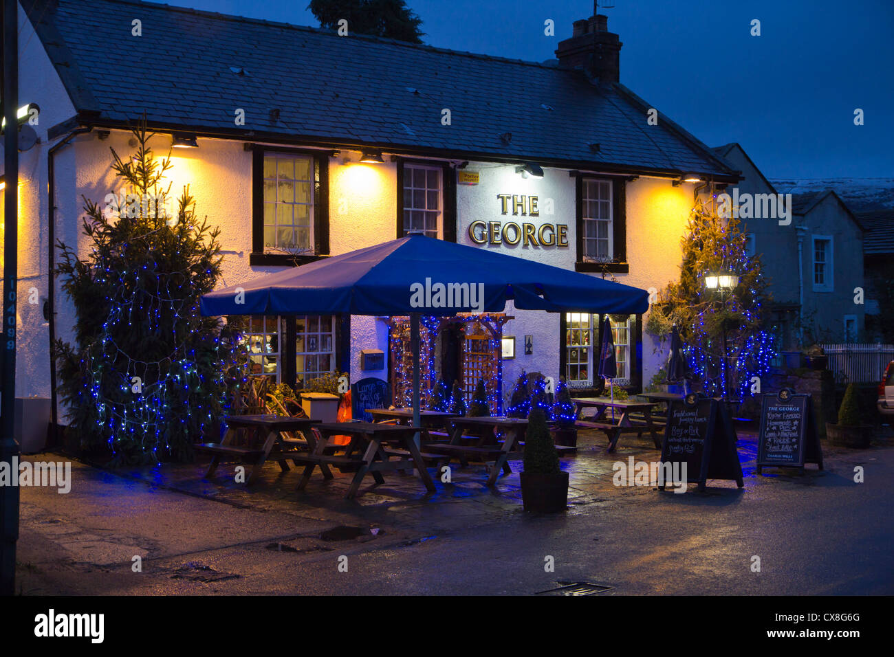 Christmas lights in the high street of the Peak District village of ...