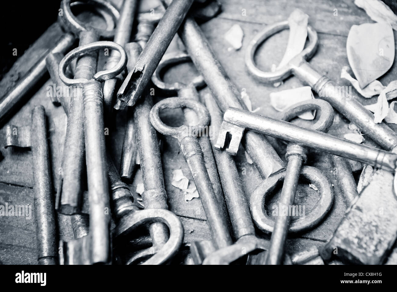 old keys on a wooden table, with color process Stock Photo - Alamy