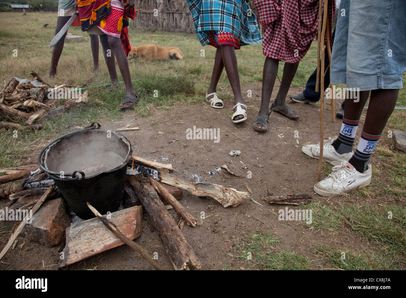 Masai men cooking a goat in Siana , next to the Masai Mara Nature ...