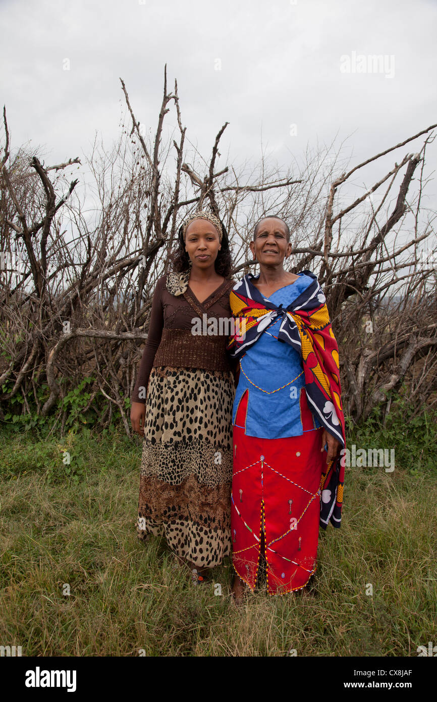 Masai mother in traditional costume and daughter with modern clothes in ...
