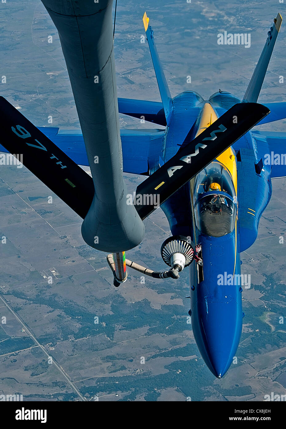 A KC-135 Stratotanker from Altus AFB refuels a Navy Blue Angel FA-18 ...