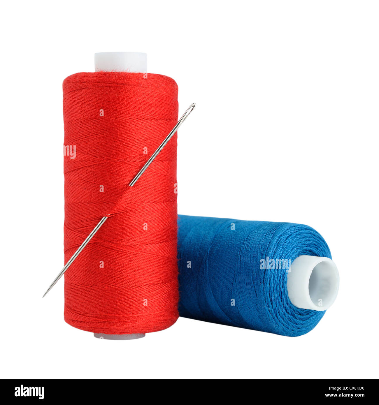 Spools of thread and needle isolated on white background Stock Photo ...