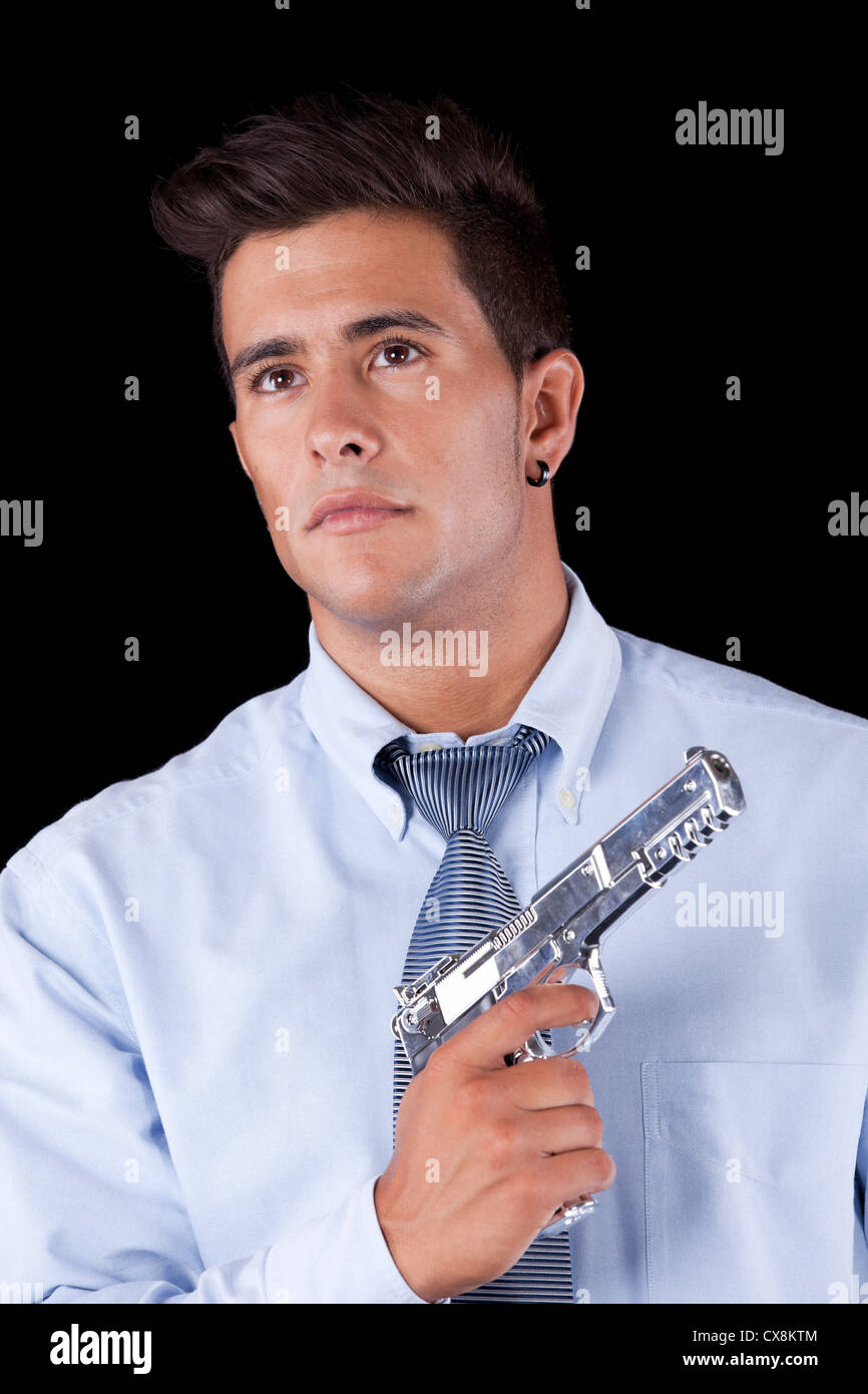 Powerful businessman with a gun (isolated on black Stock Photo - Alamy