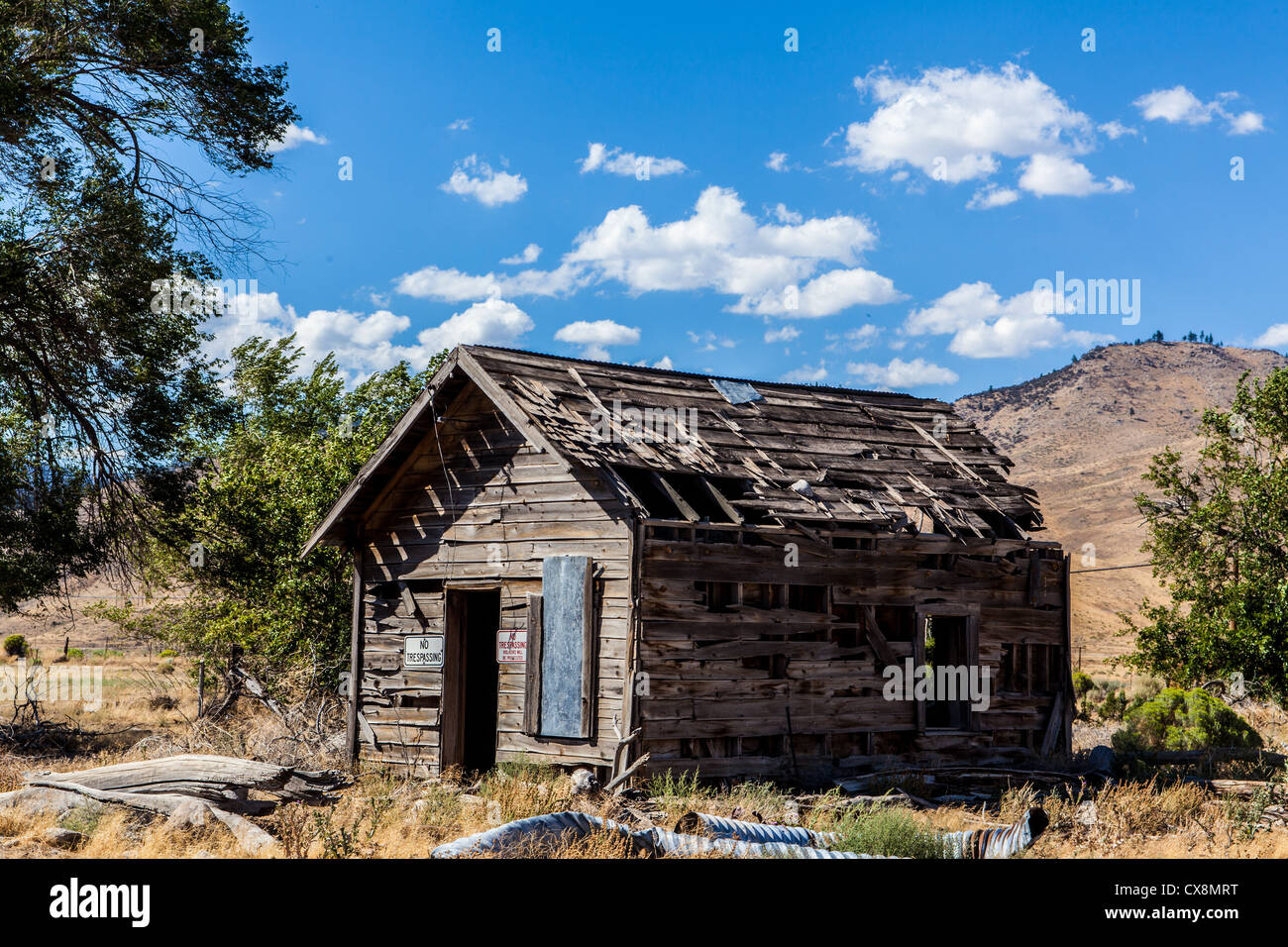A dilapidated house and water tower at an old homestead in Reno Nevada ...