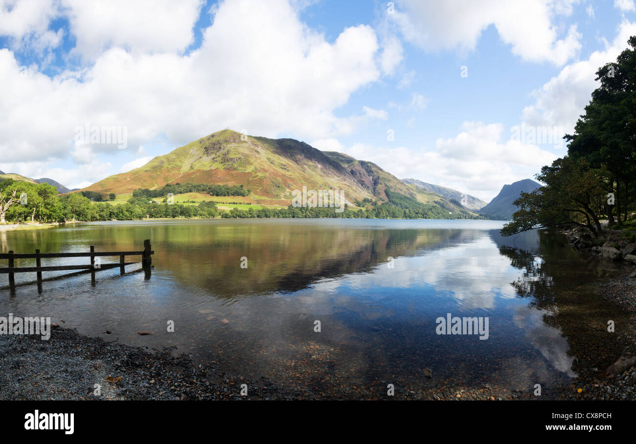 Mountains reflect into Buttermere calm lake in English Lake District ...