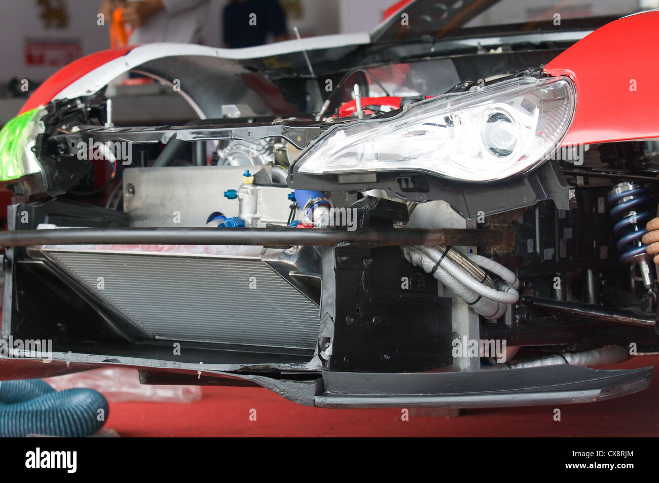 Disassembled front of racing car with radiator visible. Shallow depth ...