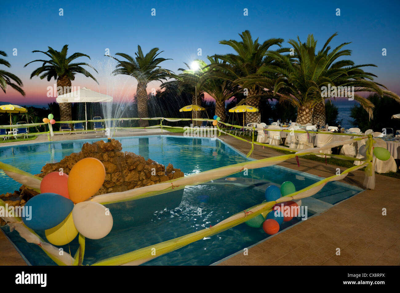 Pool side party at sunset just before the guests arrive Stock Photo - Alamy