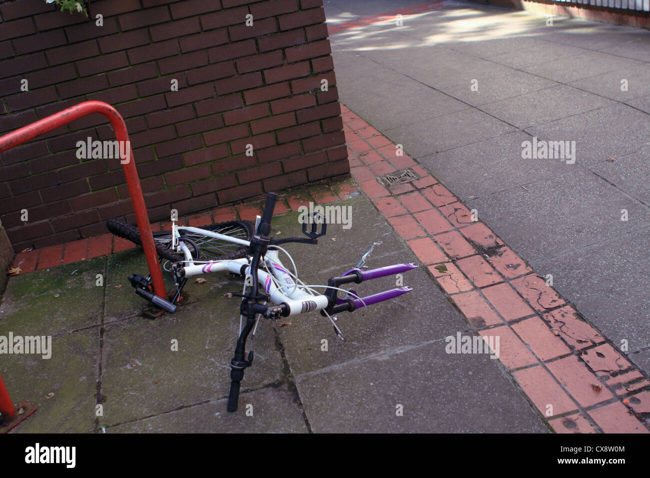 Bicycle locked to a cycle rack on a street hi-res stock photography and ...