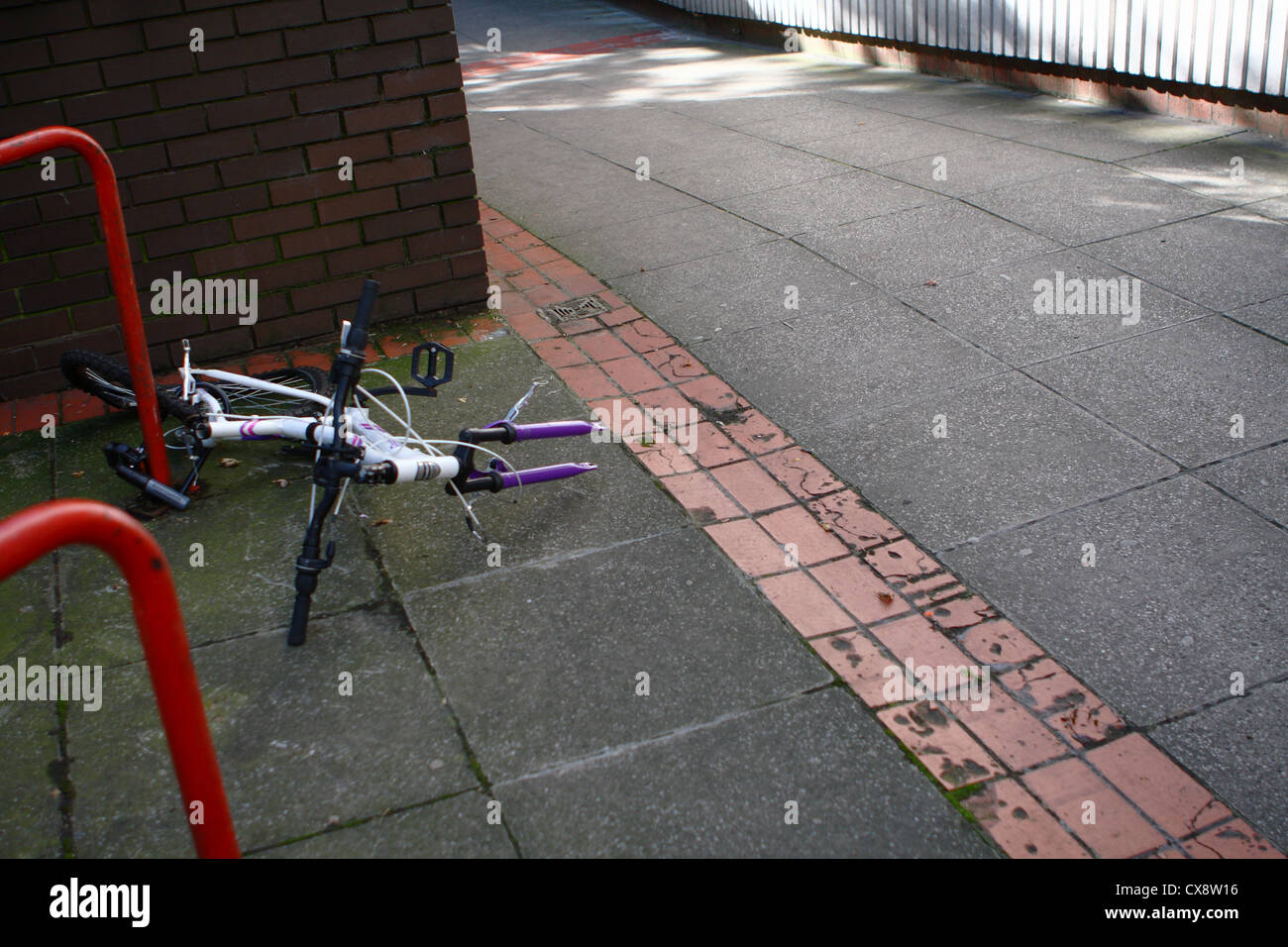 Bicycle locked to a cycle rack on a street hi-res stock photography and ...