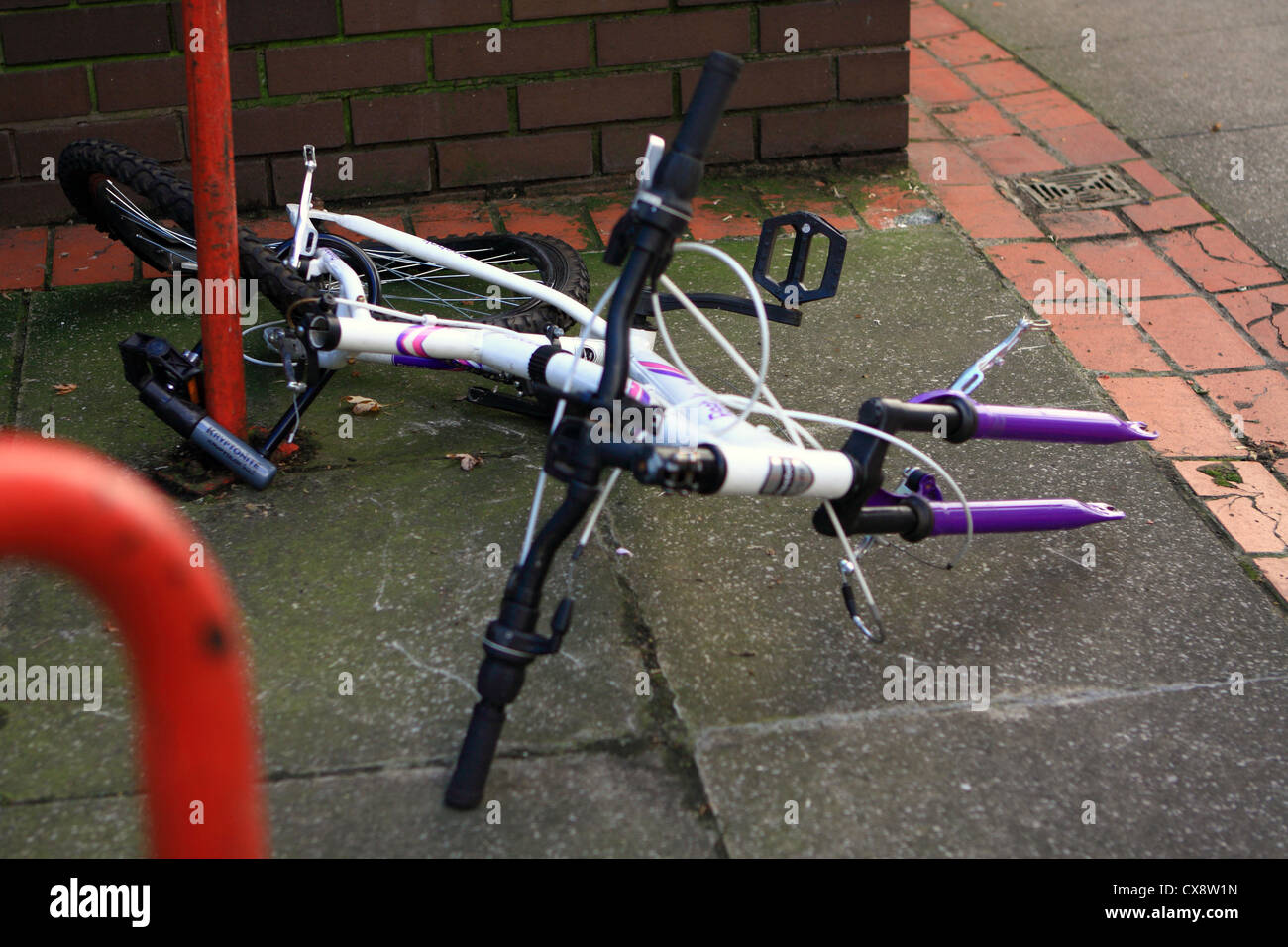 Bicycle locked to a cycle rack on a street hi-res stock photography and ...