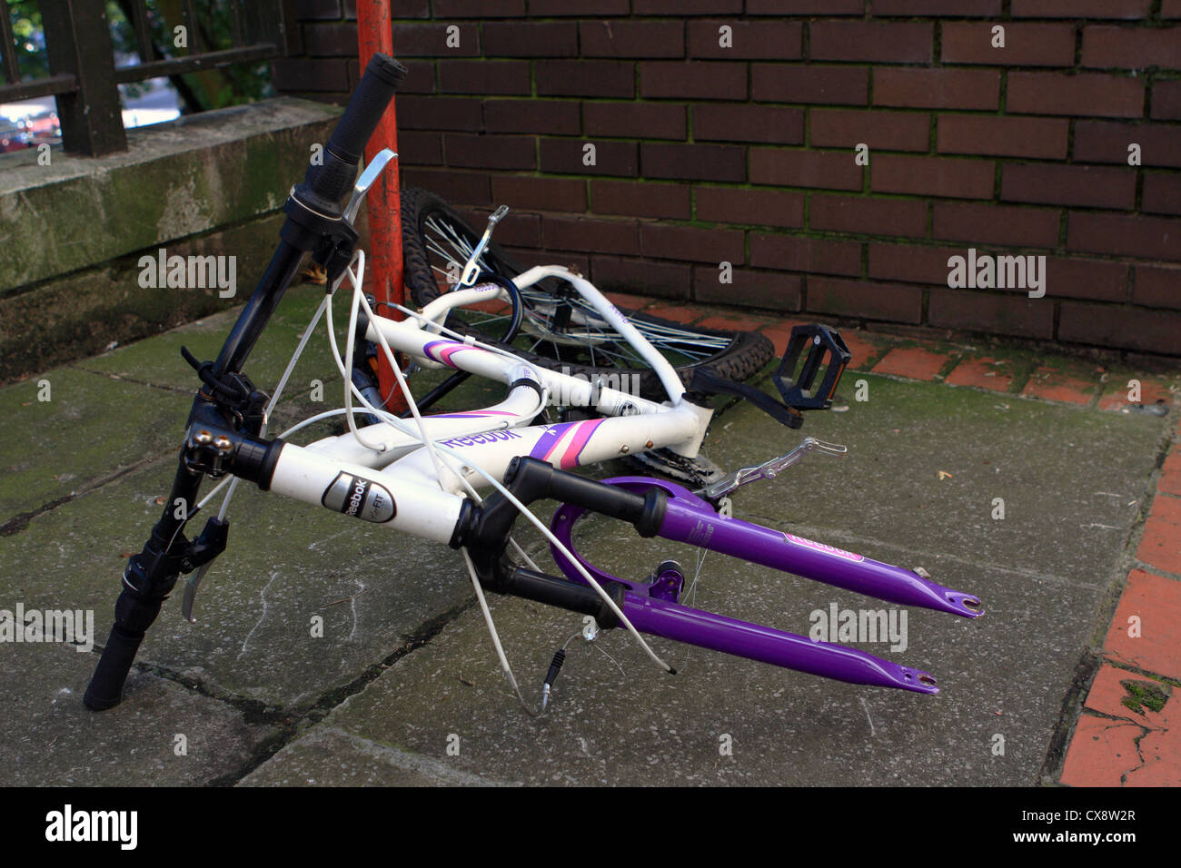 Bicycle locked to a cycle rack on a street hi-res stock photography and ...