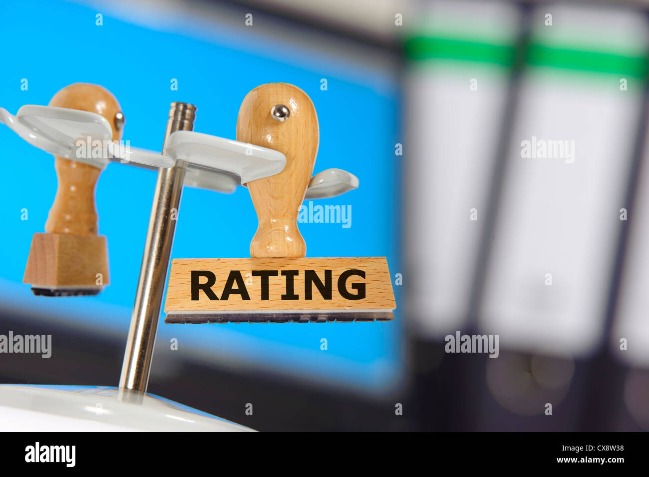 rubber stamp in hand marked with rating Stock Photo - Alamy