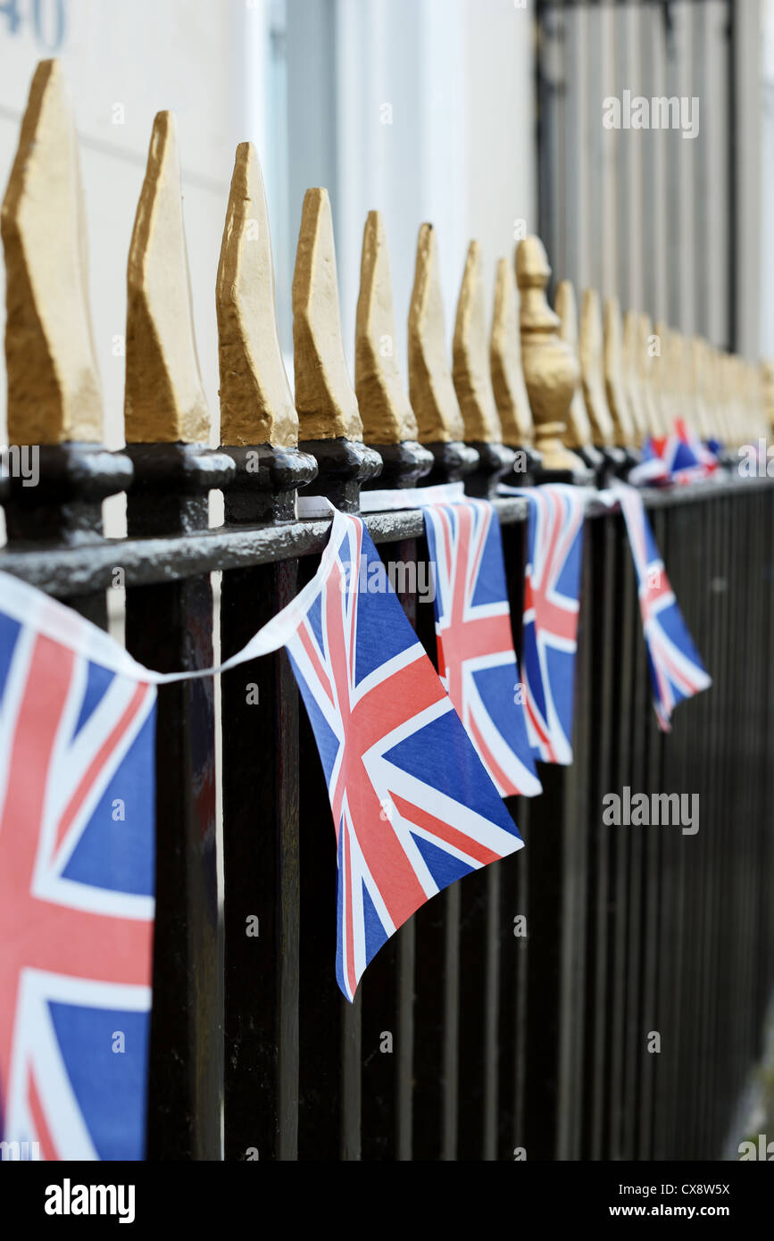 British flag bunting on iron railings Stock Photo - Alamy