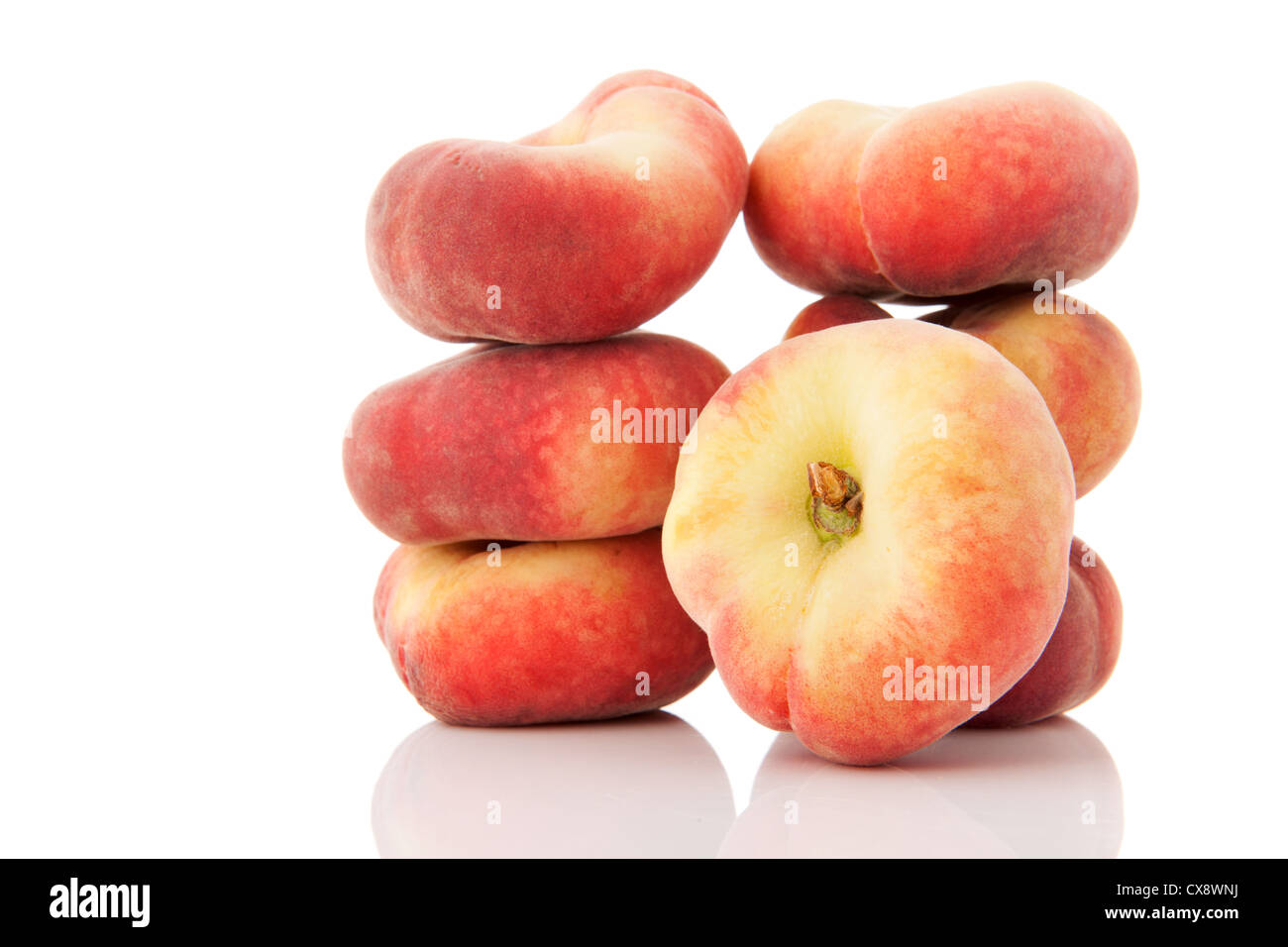 Pile wild peaches on white background Stock Photo - Alamy