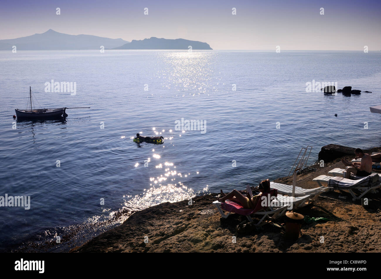 Evening bathing on the island of Agistri Greece Stock Photo - Alamy