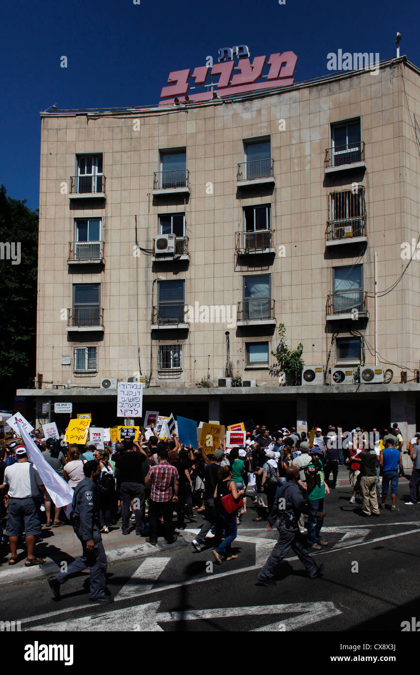Israel daily Maariv newspaper employees and their supporters hld signs ...