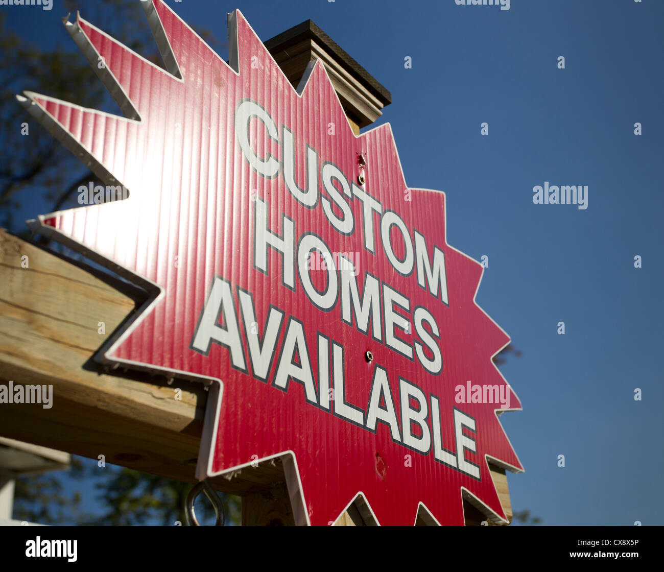 Custom homes sign at a building site Stock Photo - Alamy